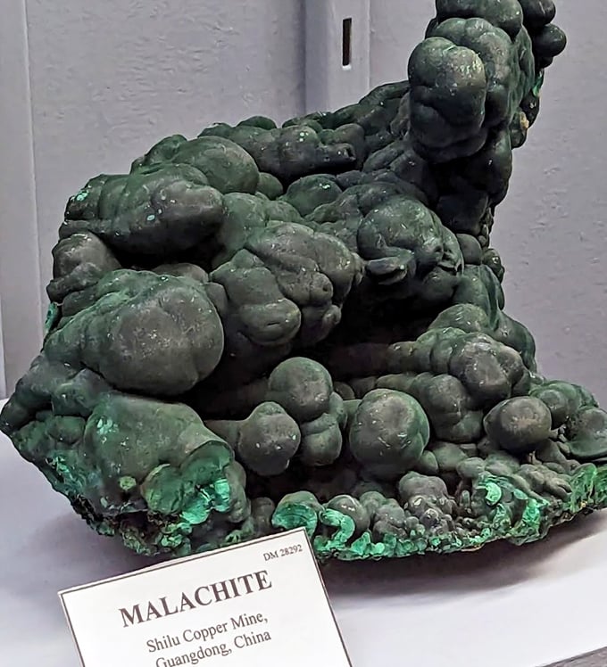 This bulbous malachite formation looks like something from an alien landscape, its green bubbles frozen in a botanical dance.