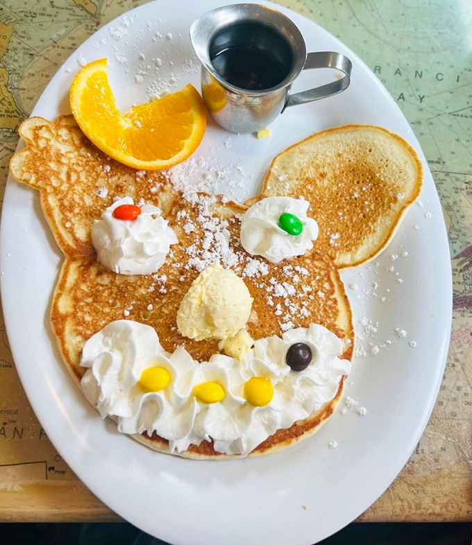 Mickey would be flattered by this pancake interpretation – a childhood memory served with grown-up coffee and a sprinkle of powdered nostalgia.