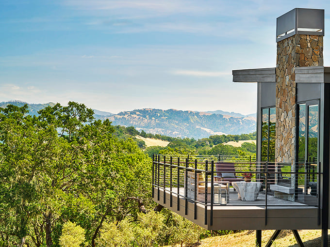This modern deck perched above rolling hills offers the kind of view that makes you forget to check your phone for days.
