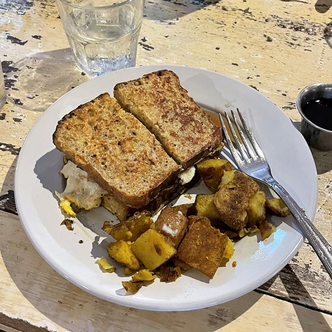Breakfast meets lunch meets your new obsession—golden-toasted bread hiding savory treasures and those perfectly seasoned potatoes playing the perfect supporting role.