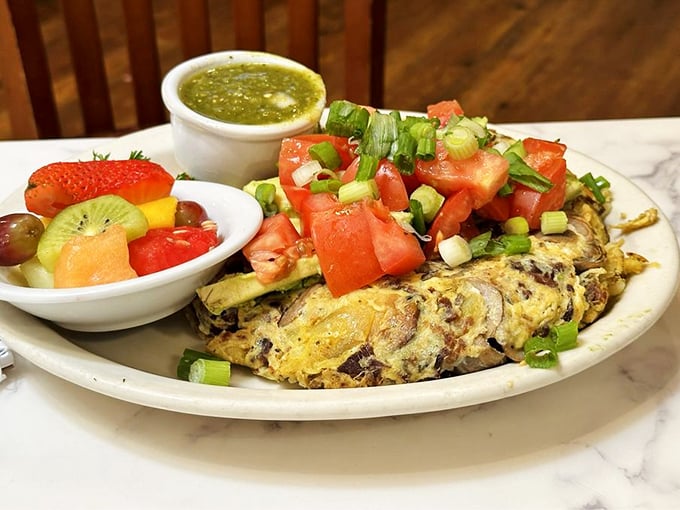 This isn't just an omelette—it's a colorful celebration wrapped in eggs with a side of California sunshine.