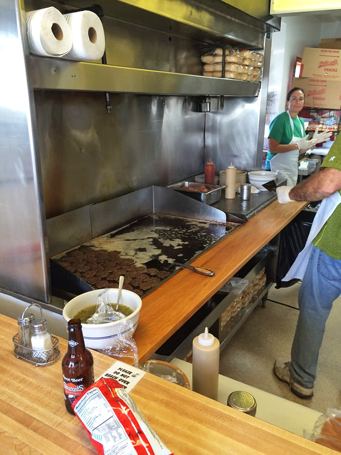 Where the magic happens. The open kitchen at Crabill's lets you witness every step of the burger-making process—from raw patty to perfection.