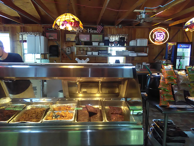 The serving line: where anticipation builds and patience is rewarded with smoky treasures from behind the counter.