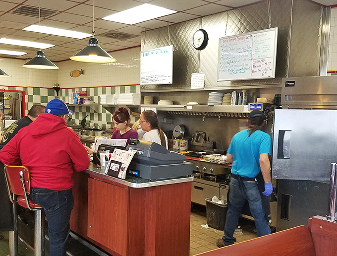 The counter where regulars perch and newcomers become regulars. Notice the perfectly positioned condiments—these people know what they're doing.