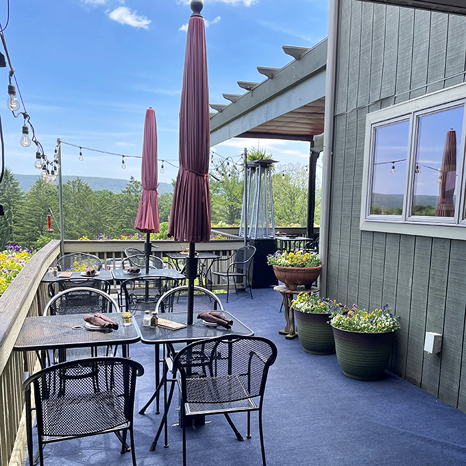 The outdoor deck doesn't just offer seating – it delivers a panoramic feast for your eyes while your taste buds wait their turn.