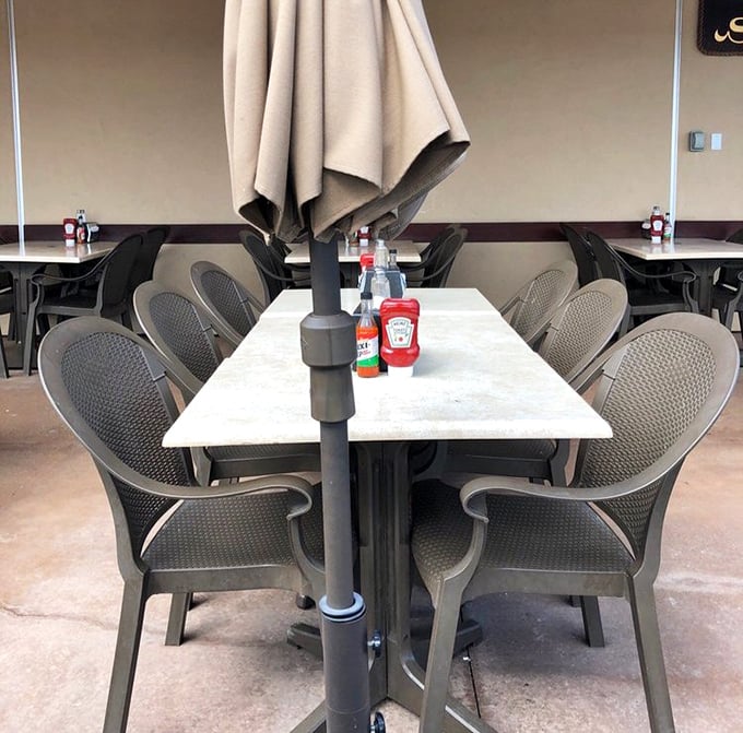 Outdoor tables where umbrellas provide shade while you contemplate the serious business of which seafood delight to try next.