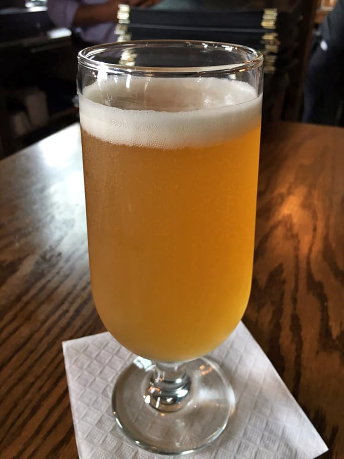 This golden beer with its perfect foam collar isn't just a drink – it's a reward for making good life choices, like visiting Piedmont Steakhouse.