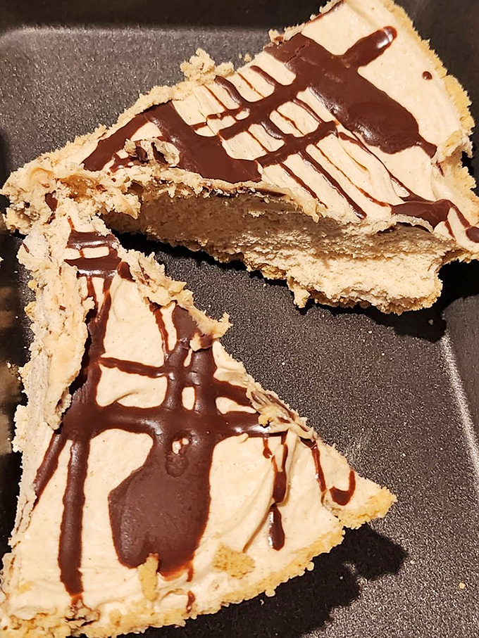 Peanut butter pie with chocolate drizzle—where comfort food meets elegant dessert. Even after a massive steak, you'll mysteriously find room for this.