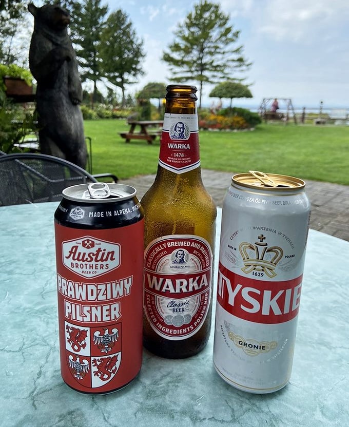 The holy trinity of Polish brews—Tyskie, Warka, and Austin Brothers—standing at attention on a table with Lake Michigan providing the perfect backdrop.