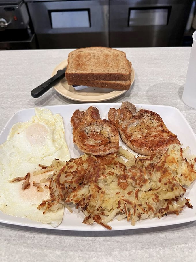 Pork chops, eggs, and hash browns: the breakfast equivalent of a power suit. You're ready to conquer the world after this plate.