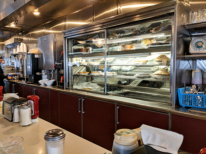 The prep station where diner magic happens—gleaming stainless steel and organized chaos working in perfect harmony to keep hungry patrons satisfied.