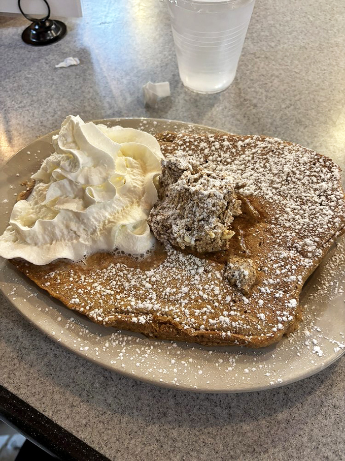Not just a pancake—a canvas of autumn comfort topped with whipped cream clouds. The kind of breakfast that makes you reconsider your life choices—in the best way.