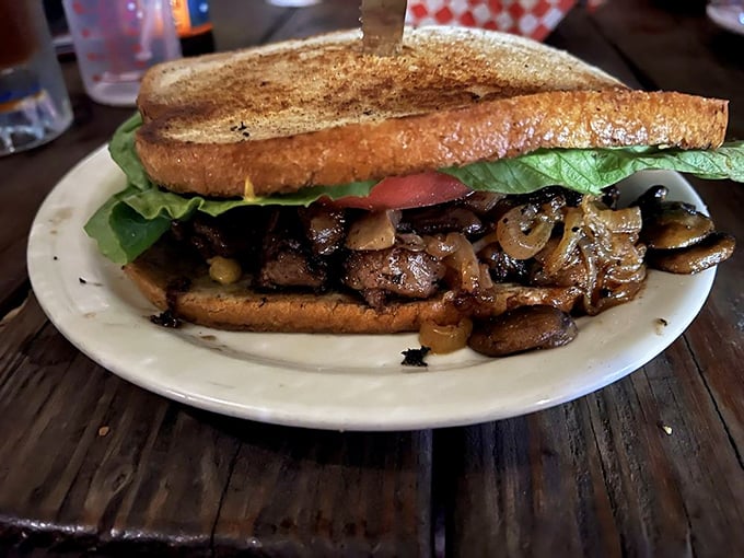 The ribeye sandwich that makes vegetarians question their life choices. Those sautéed mushrooms and onions are no mere toppings.