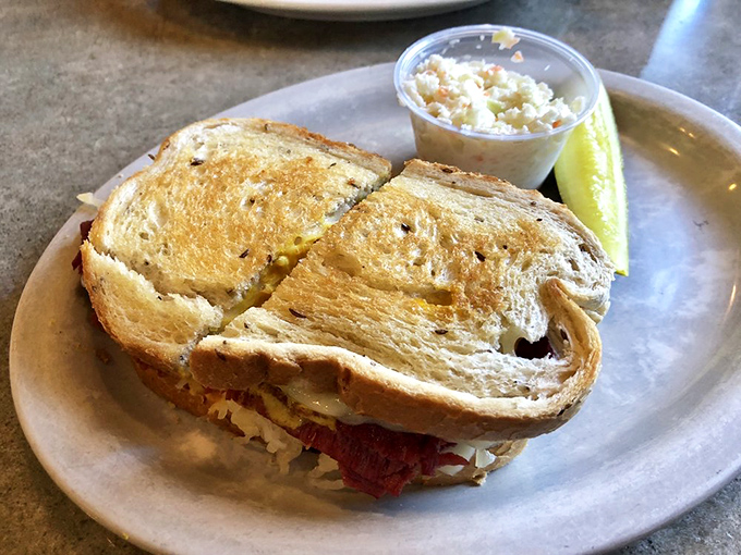 A Reuben sandwich that's achieved perfect balance—like a zen master of corned beef, sauerkraut, and melted Swiss in perfect harmony.