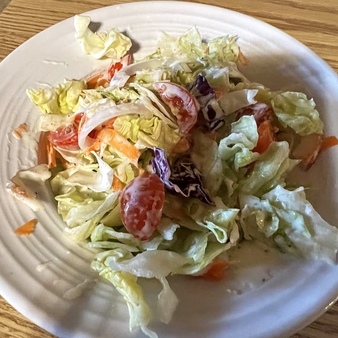 Even the garden salad gets special treatment here—fresh, crisp, and colorful, it's the palate cleanser between seafood adventures.