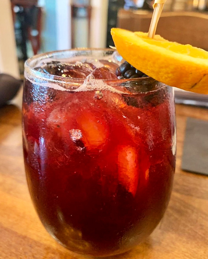 This sangria isn't just a drink—it's a vacation in a glass. The orange slice isn't garnish; it's a reminder you're in Florida.