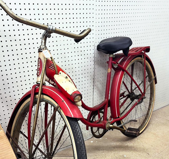 This vintage Schwinn isn't just transportation—it's childhood freedom, summer adventures, and skinned knees all wrapped in cherry-red nostalgia.