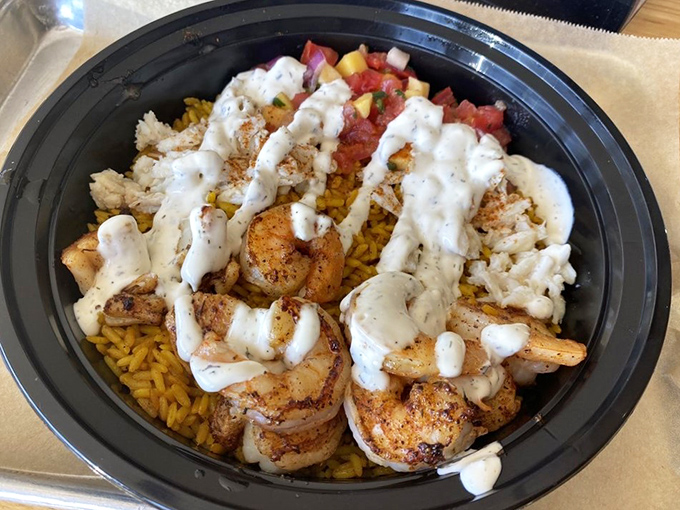 Seafood bowls that make you wonder why you'd ever eat seafood any other way—perfectly seasoned shrimp over saffron rice with house-made sauce.