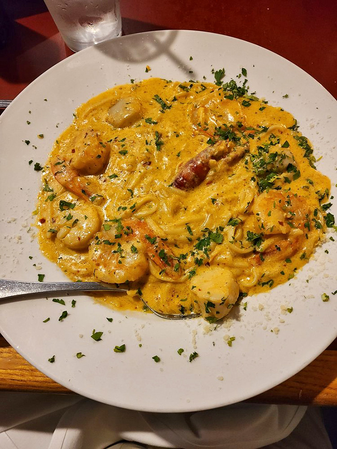 Seafood linguine that brings the Mediterranean to Missouri - a sunshine-colored sauce embracing shrimp like long-lost friends at a delicious reunion.