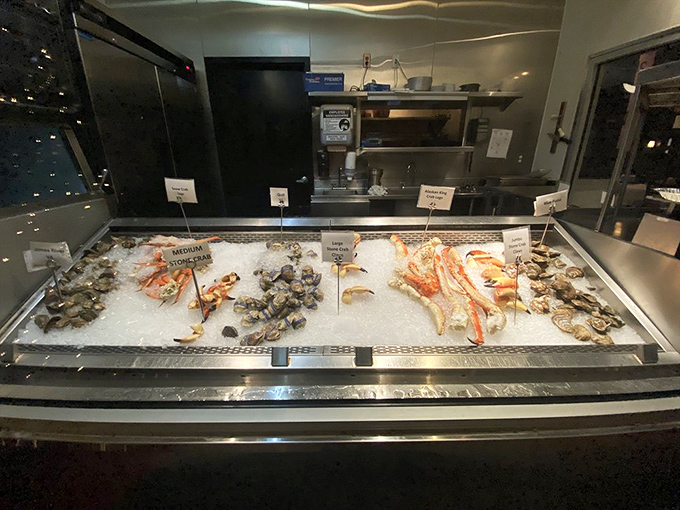 The seafood display case—where dinner auditions for your approval. These ice-chilled performers are ready for their moment in the spotlight.