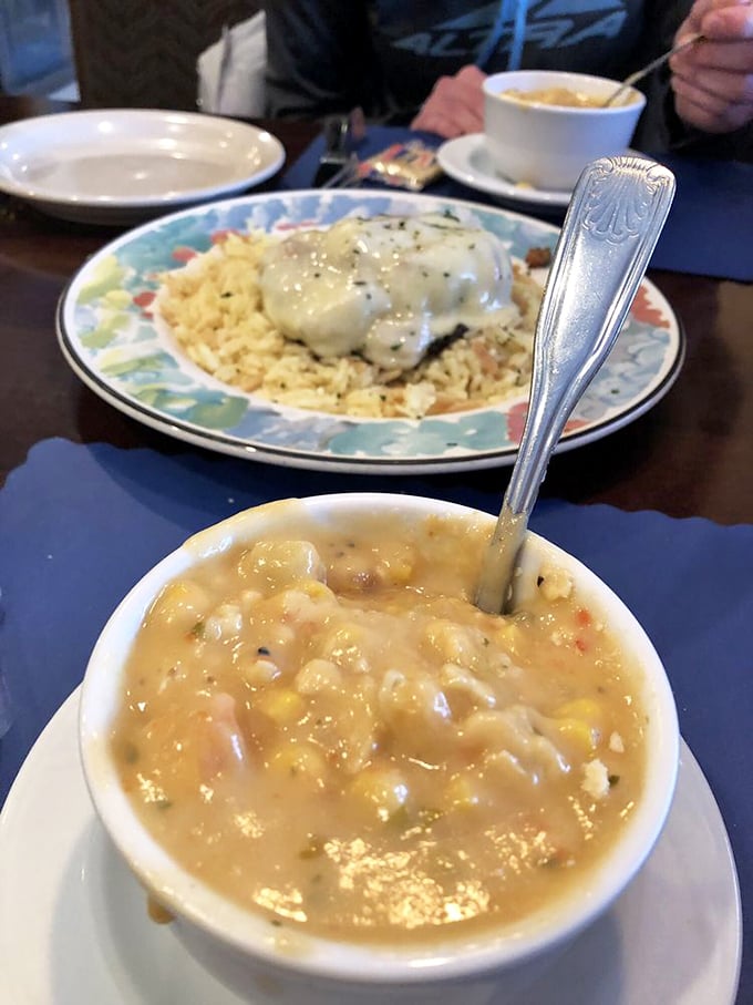 A bowl of corn chowder that's basically comfort in liquid form—like a warm hug from your grandmother, if your grandmother was an award-winning chef.