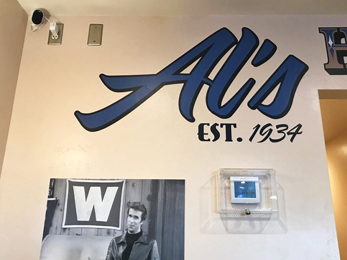 That blue neon "EAT" sign isn't just advertising—it's a one-word poem about life's simplest and most satisfying pleasure.