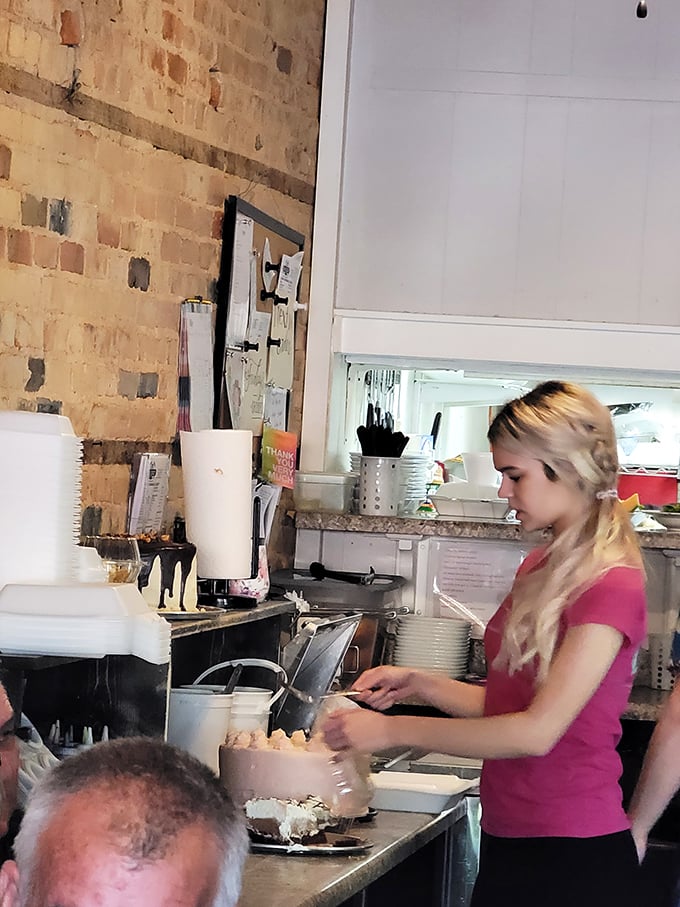 Behind every great dessert is someone with magic in their hands. This moment of cake preparation is like watching an artist put final touches on a masterpiece.