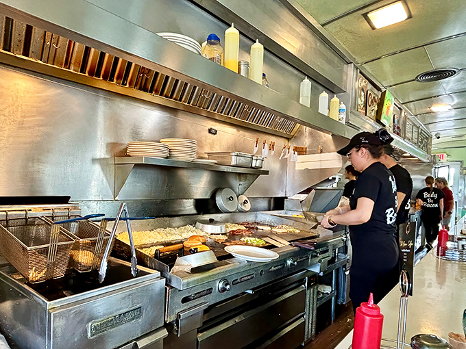 The choreography of a well-run diner kitchen is better than any Broadway show. These folks aren't just cooking—they're performing breakfast ballet.