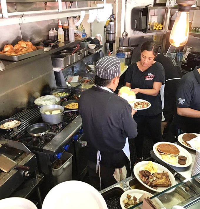 The kitchen ballet unfolds as plates emerge like works of art—pancakes, eggs, and toast performing under the watchful eyes of breakfast conductors.