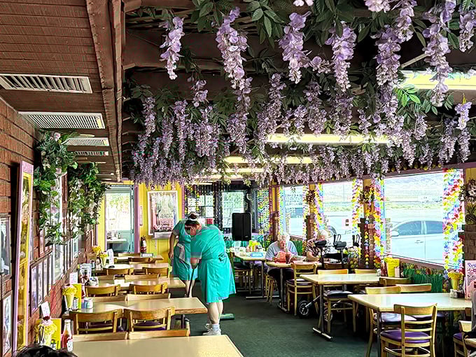 The garden room blooms with artificial wisteria, creating a surreal oasis where desert-weary diners can pretend they're lunching in Capri instead of Yermo.