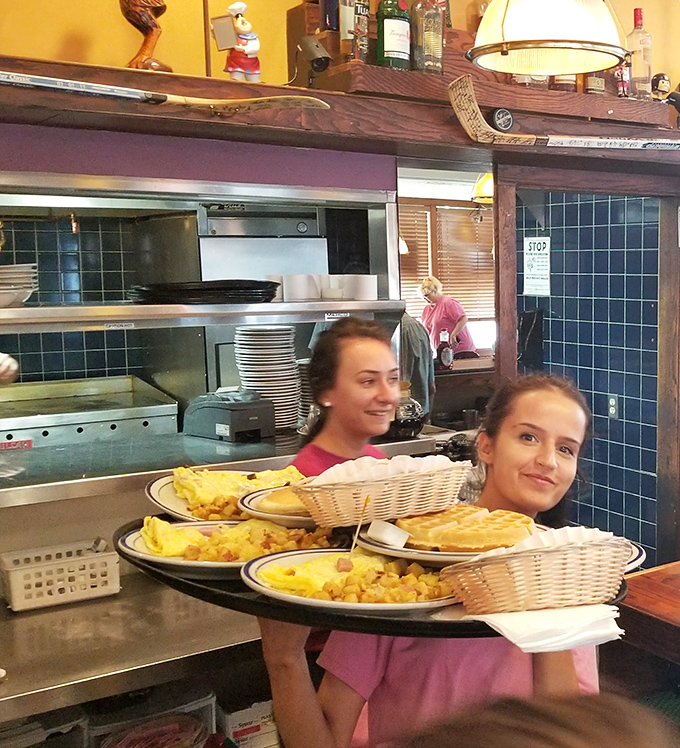 Breakfast heroes don't wear capes—they carry trays loaded with enough eggs and pancakes to fuel a beach day.