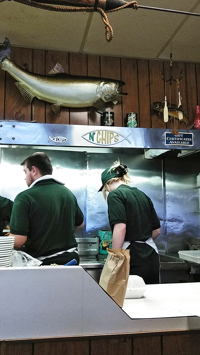 Behind every perfect piece of fish are dedicated folks in green shirts, working magic with flour, batter, and decades of deep-frying wisdom.