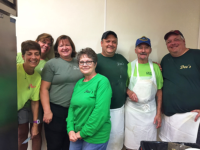 The team behind the magic – wearing their Dee's green with pride and carrying decades of breakfast wisdom in their skilled hands.
