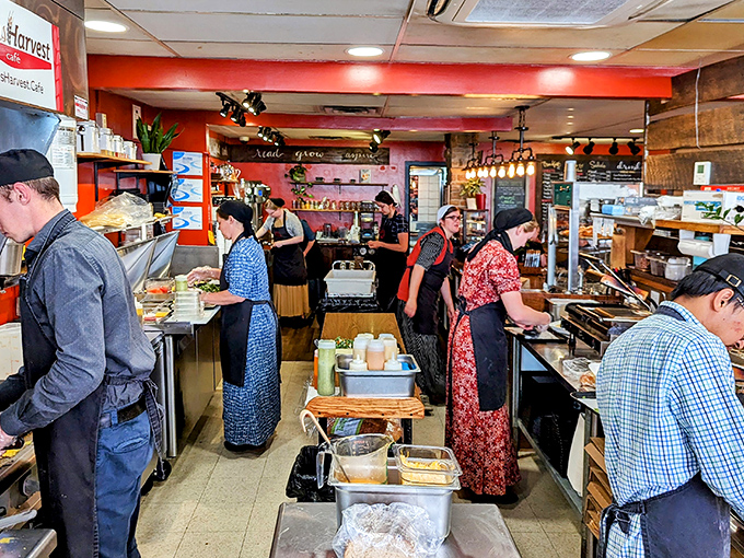 Where the magic happens—staff members working with purpose and passion in a kitchen that feels like the heart of the café.