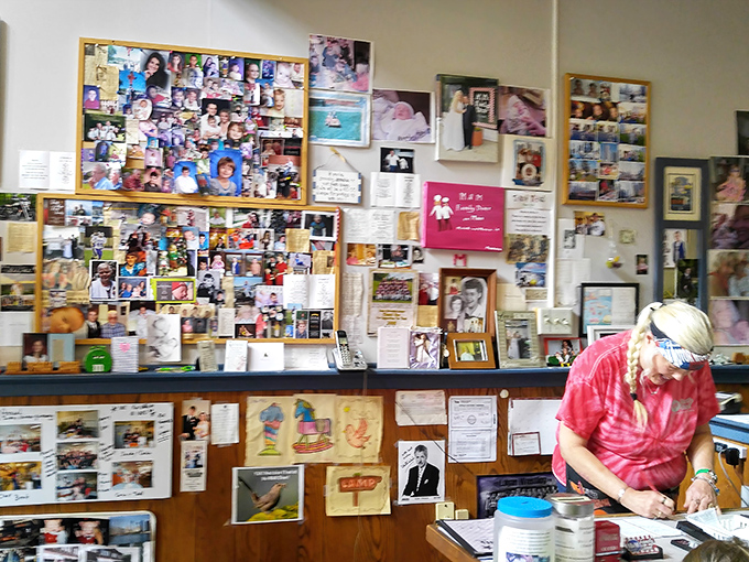 The wall of memories behind the counter isn't decoration—it's the heart of the place. Years of community connection displayed with pride.