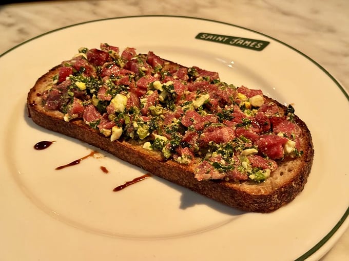 Steak tartare on toast—where raw sophistication meets primal satisfaction in a dish that says, "Yes, I'm worldly AND hungry."