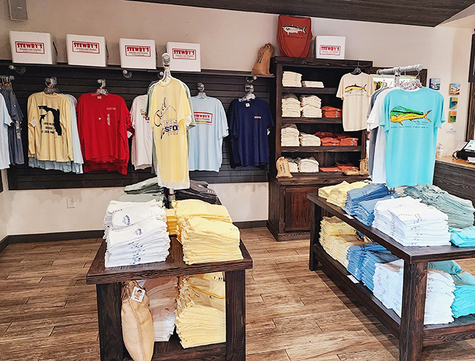 The merch area proves Stewby's isn't just a meal—it's a lifestyle. Those t-shirts are the Gulf Coast equivalent of concert souvenirs.