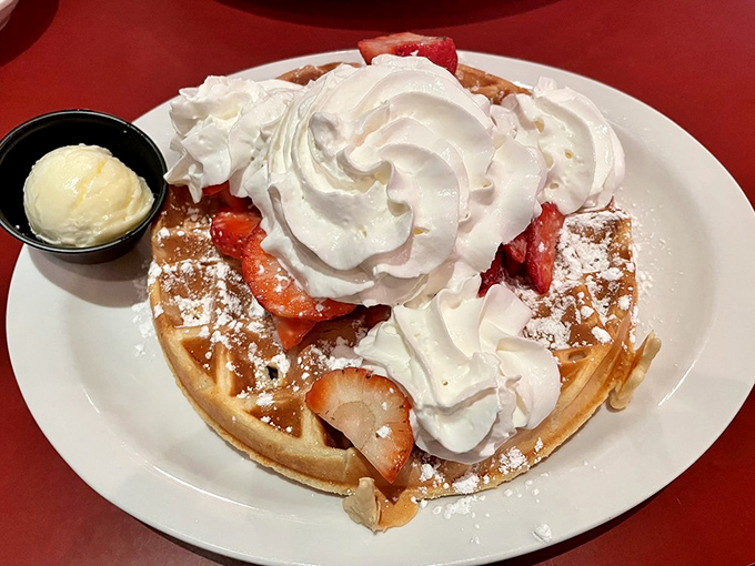 A waffle that's dressed for success with strawberries, whipped cream, and enough joy to power you through any Monday.