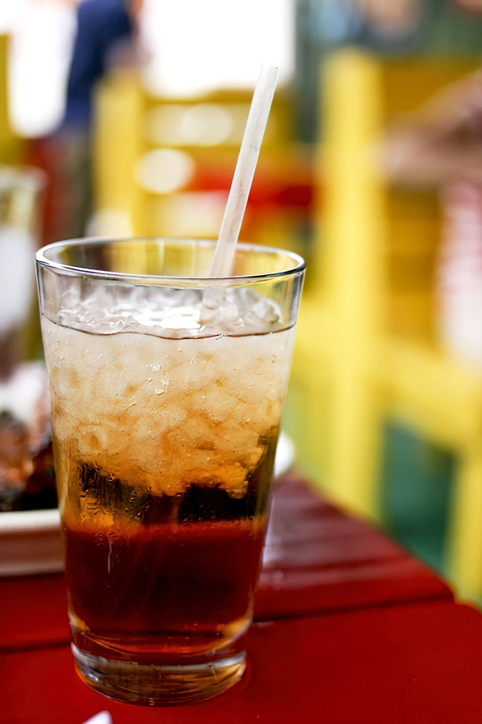 Sweet tea in its natural habitat: alongside barbecue on a red table. The unofficial state beverage of Georgia never looked so good.