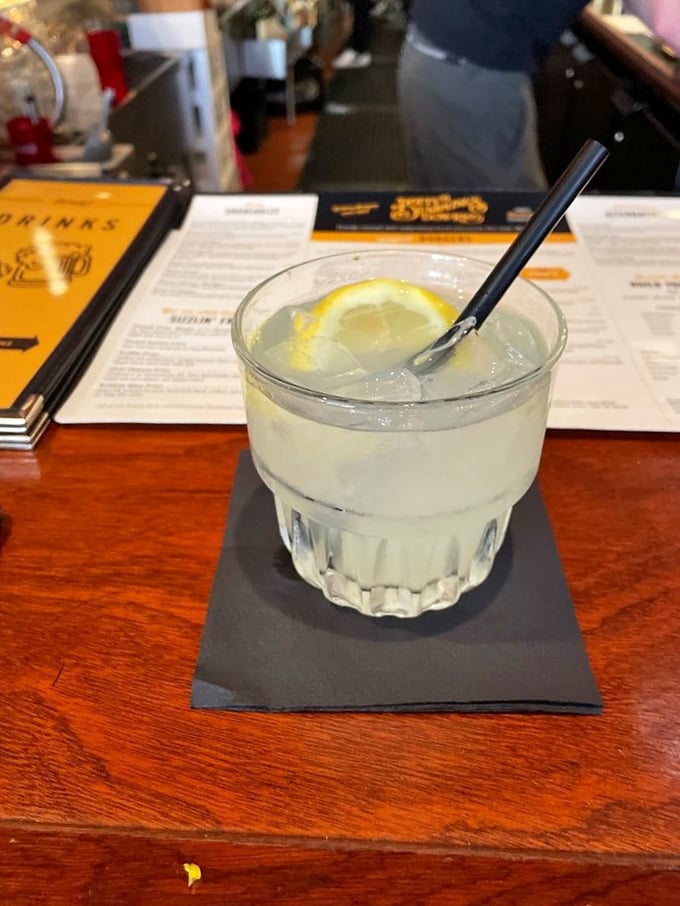 Clear, crisp, and dangerously refreshing—this Tom Collins is what would happen if summer vacation took liquid form. The perfect burger companion.
