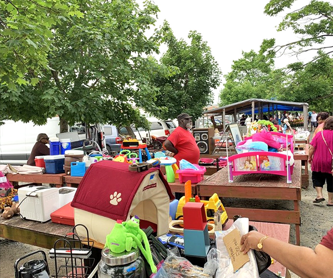 Outdoor vendors transform the parking area into an impromptu village of possibilities, where children's toys await their second chance at playtime.
