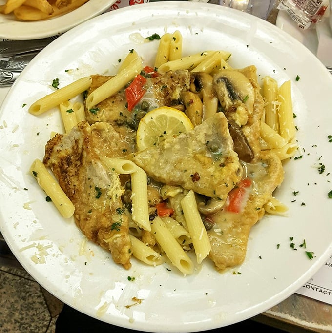 Veal piccata with pasta that doesn't just sit on your plate—it performs, with lemon and capers providing the perfect supporting cast.