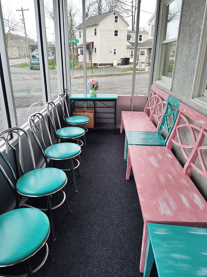 The waiting area's turquoise and pink seating feels like a '50s postcard come to life—worth every minute of anticipation.