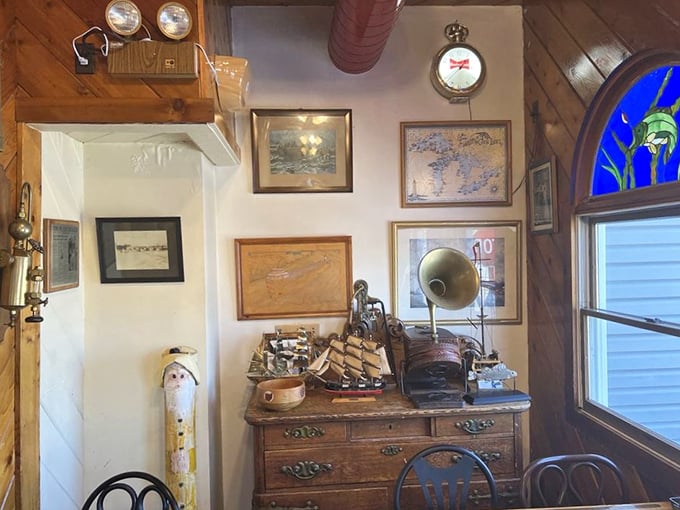 Not just wall decor—it's a maritime museum where every piece whispers tales of Great Lakes adventures between bites.