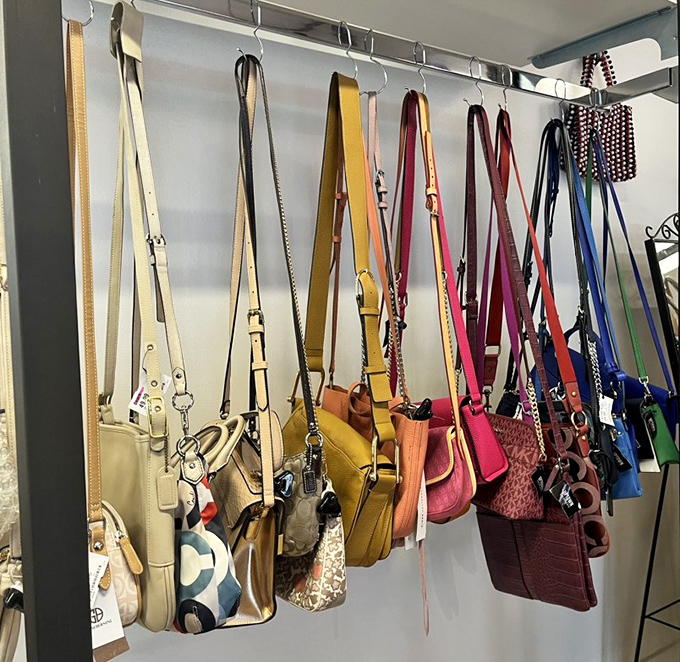 Handbag heaven hanging in technicolor glory. Your next statement accessory is here, waiting for its second act.