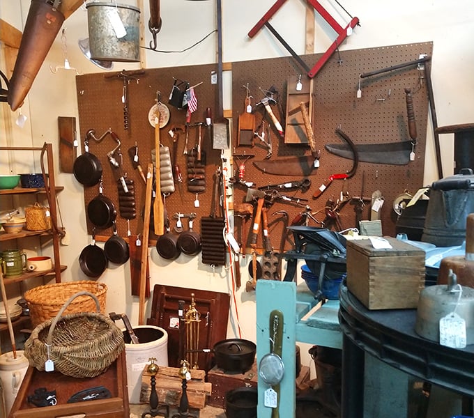 Tools that built America, hanging like badges of honor—each worn handle representing countless hours of someone's craftsmanship.