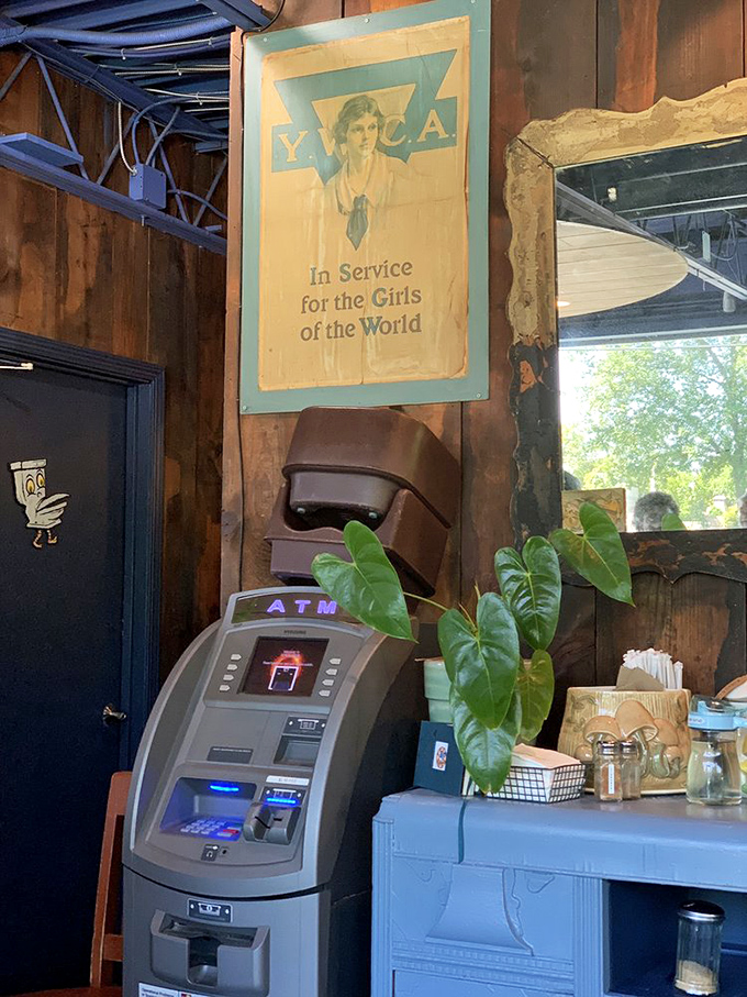 Vintage signs and lush plants make even waiting by the ATM a visual feast. This place understands ambiance isn't just about the dining room.