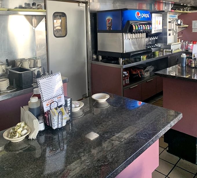 Behind the counter magic happens—where coffee flows like a river and breakfast orders fly faster than Lincoln's Gettysburg Address.