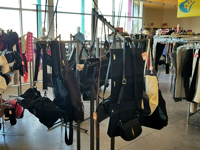 The handbag section dangles with possibilities—from practical totes to evening clutches. Yesterday's fashion statements await their second act with new owners.