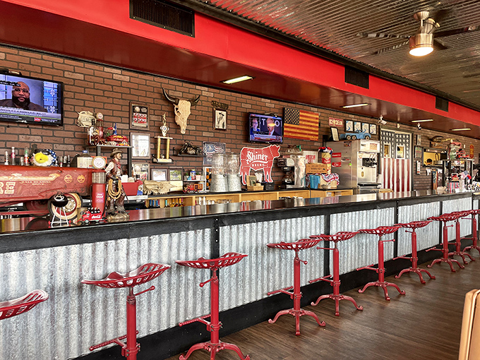 That corrugated metal bar front with vintage-style stools isn't just seating—it's a front-row ticket to the greatest show on earth: watching BBQ masters at work.